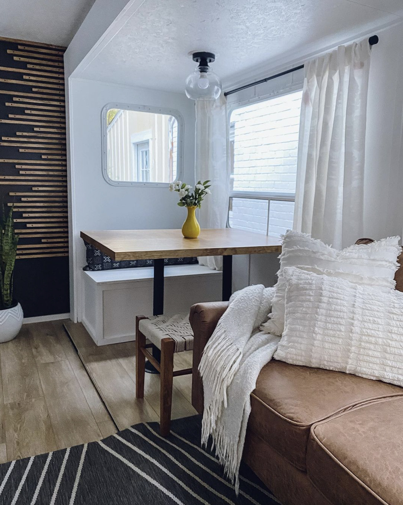 Peek inside this modern boho travel trailer by @ourtribeof5ive