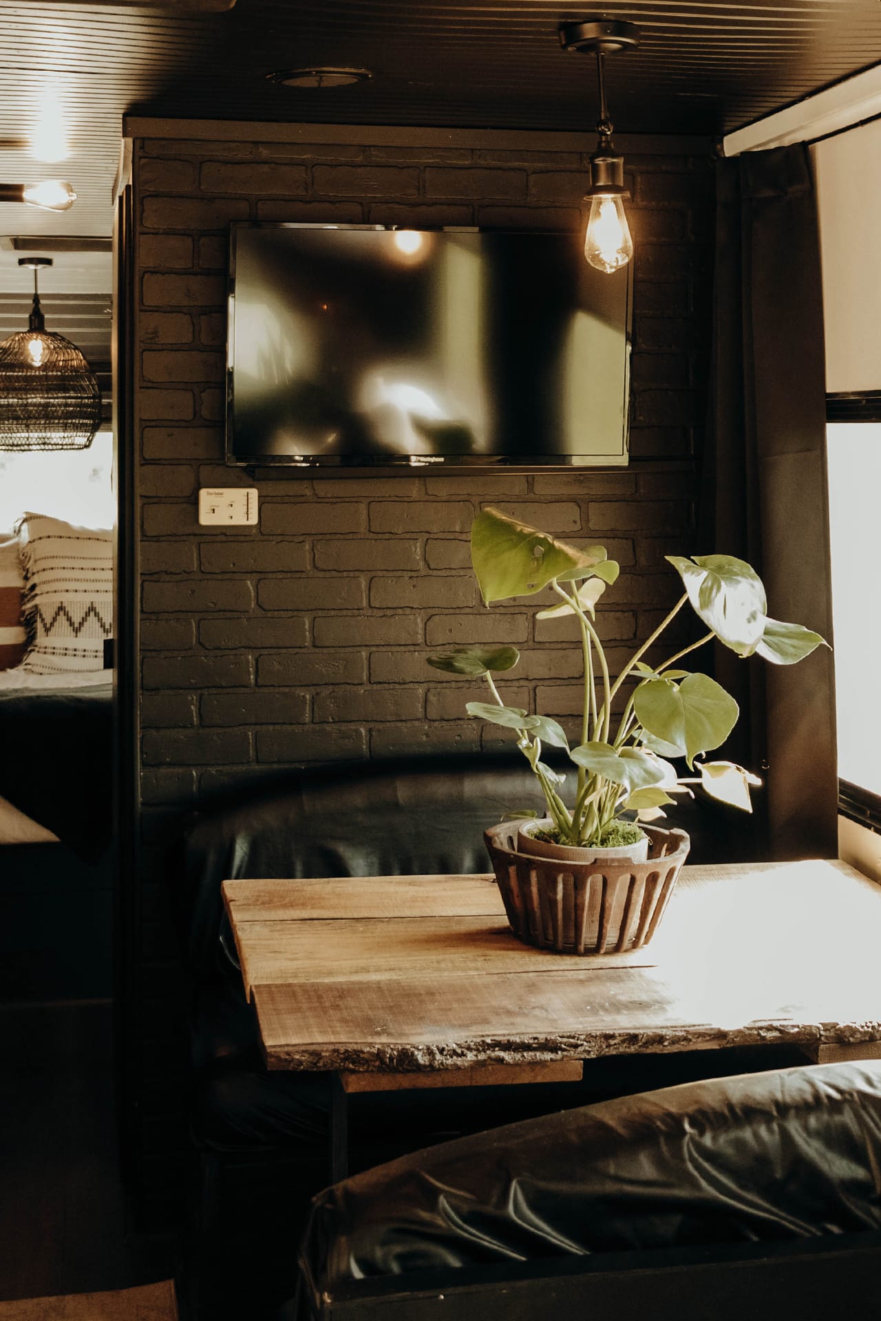 This moody RV interior includes a preserved moss wall